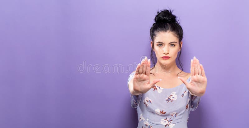 Young Woman Making a Stop Pose Stock Photo - Image of purple, girl ...