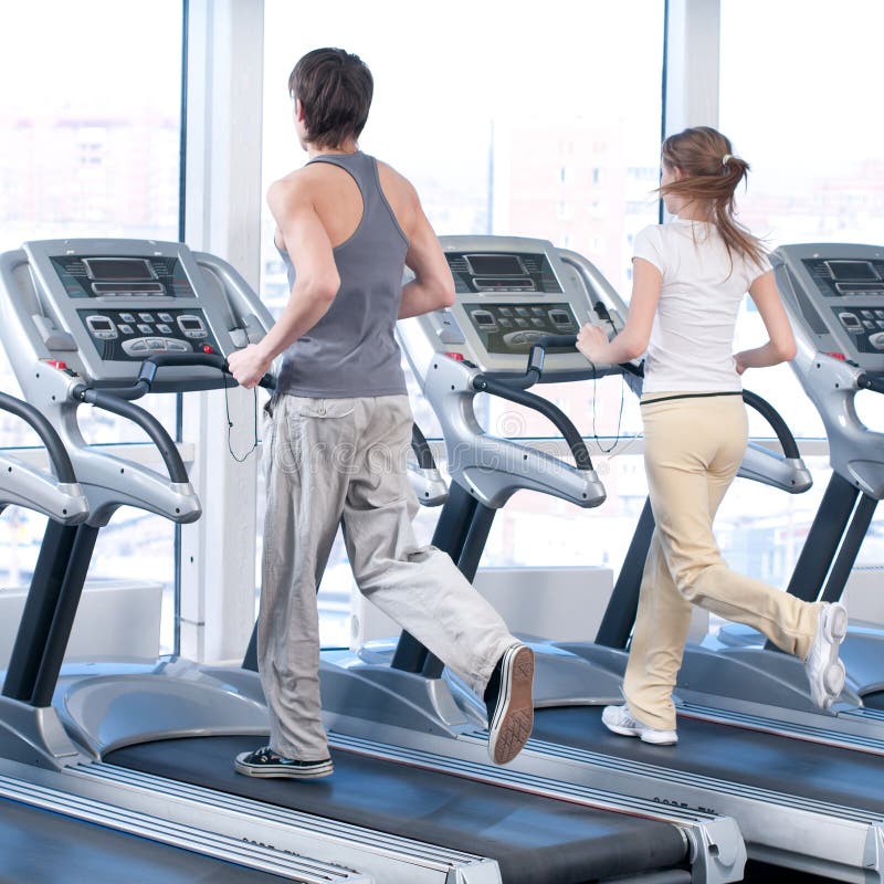 Young Woman at the Gym. Run on a Machine Stock Photo - Image of action ...