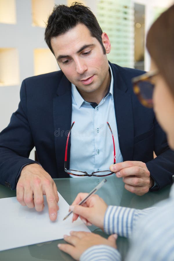 Young Woman and Man Signing Contract Stock Image - Image of advisor ...