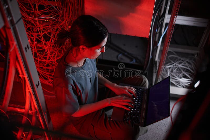 Young Woman Managing Server Network in Red Light Stock Photo - Image of ...