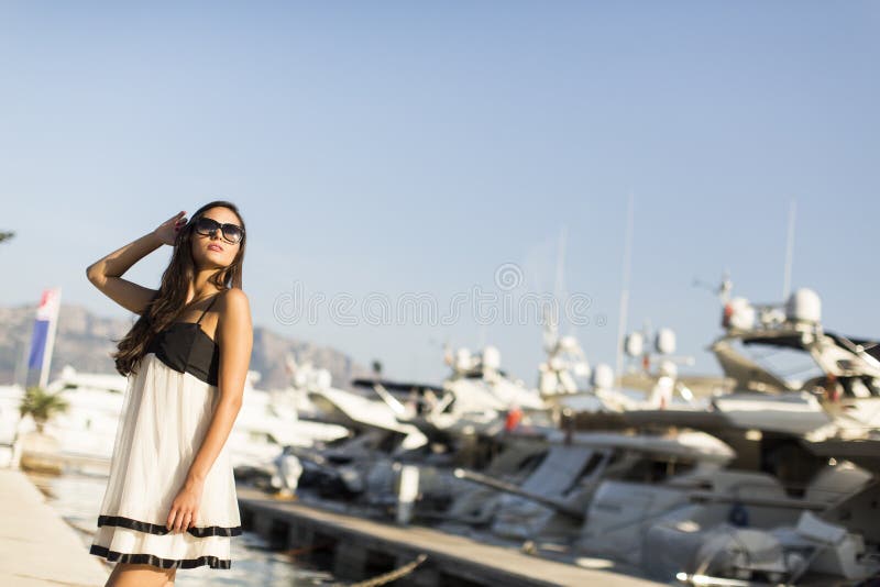 Young woman in marina stock photo. Image of sailboat - 64754308