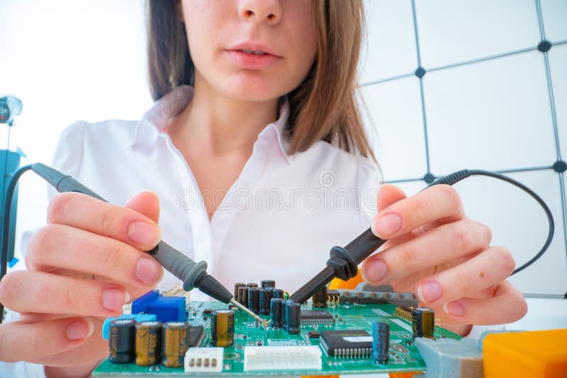 Young Woman with Measuring Devices in the Electronics Engineer Laboratory Stock Photo - Image of ...