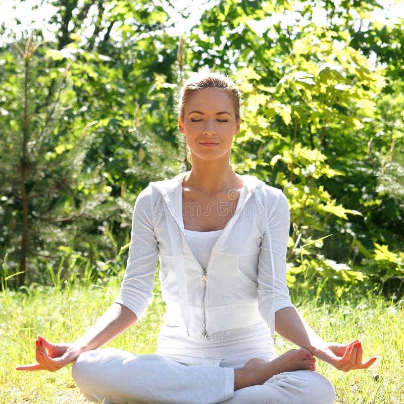 Woman Meditating in Lotus Position Outdoor. Chakra Lights Over Her Body ...