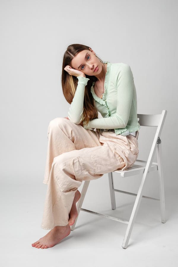 Young Woman Model Sitting and Posing in Studio Portrait Stock Photo ...