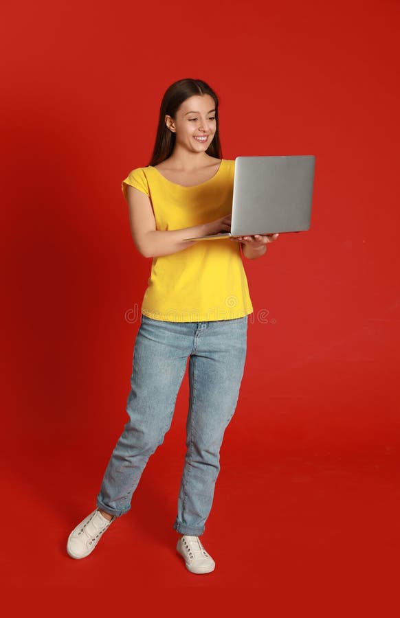 Young Woman with Modern Laptop on Red Background Stock Image - Image of ...