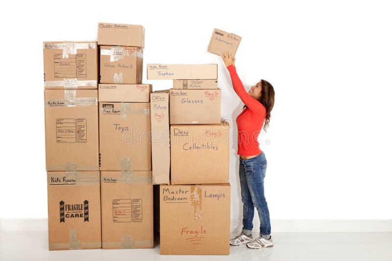 Young Woman Moving Boxes with with a Hand Truck or Dolly. Stock Image ...
