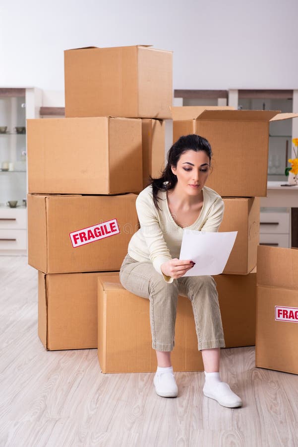 The Young Woman Moving To New Flat Stock Photo - Image of flat, moving ...