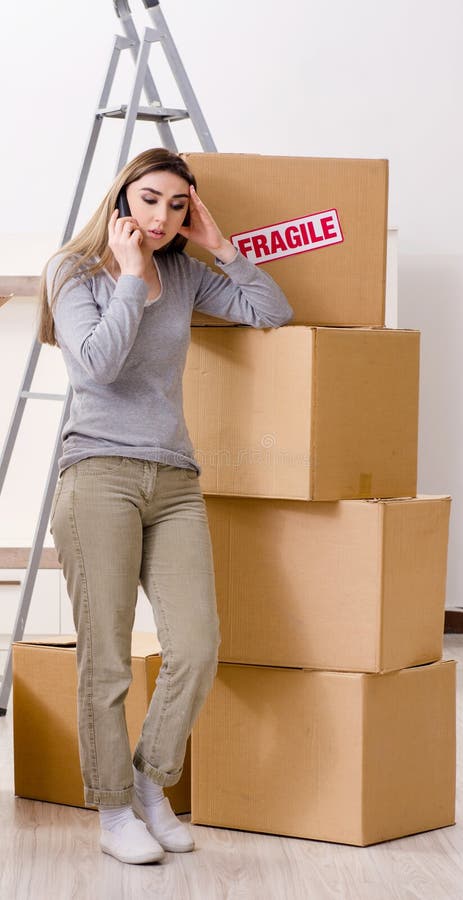 Young Woman Moving To New Flat Stock Photo - Image of parcel, loan ...