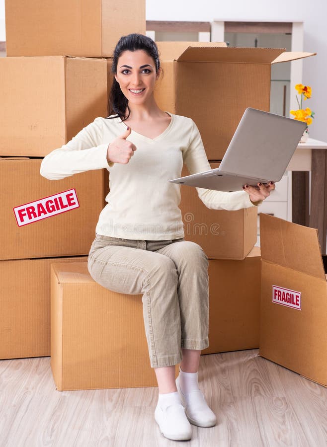 Young Woman Moving To New Flat Stock Image - Image of cardboard, move ...