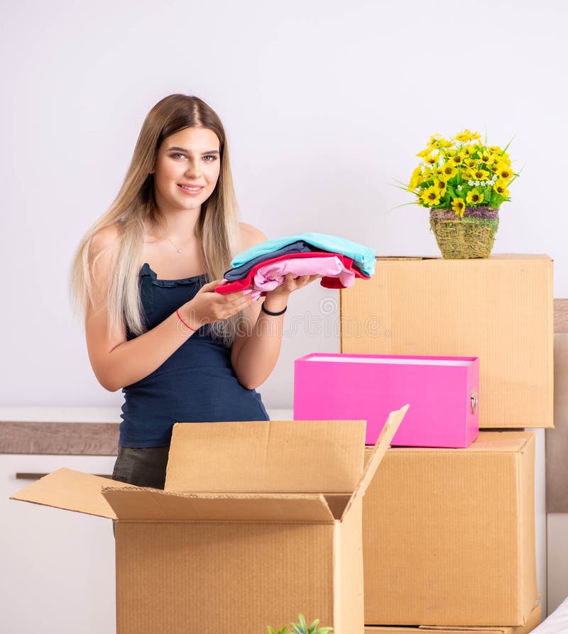 Young Woman Moving To New Place Stock Image - Image of package, moving ...