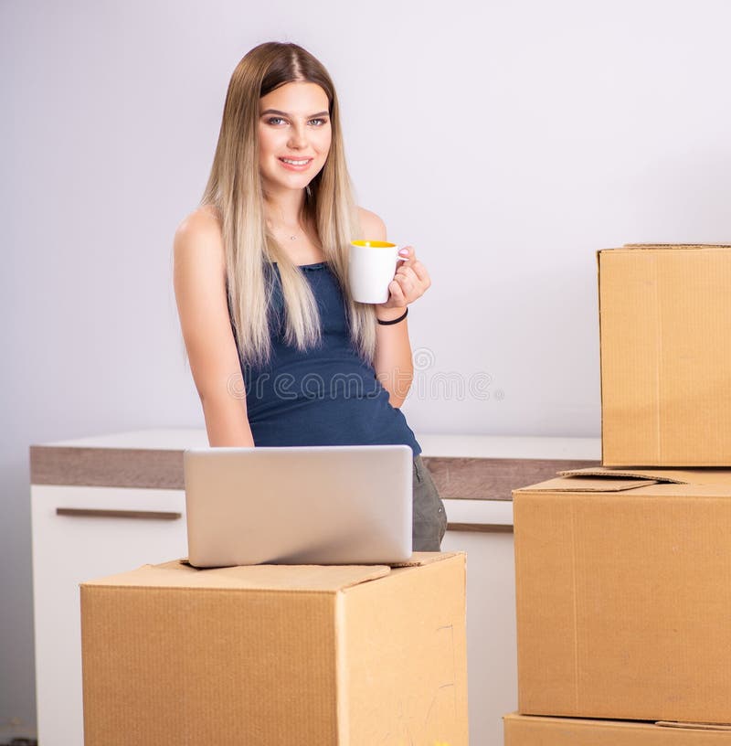 Young Woman Moving To New Place Stock Photo - Image of home, boxes ...