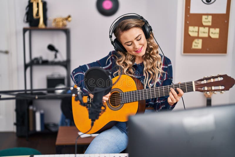 Young Woman Musician Playing Classical Guitar at Music Studio Stock ...