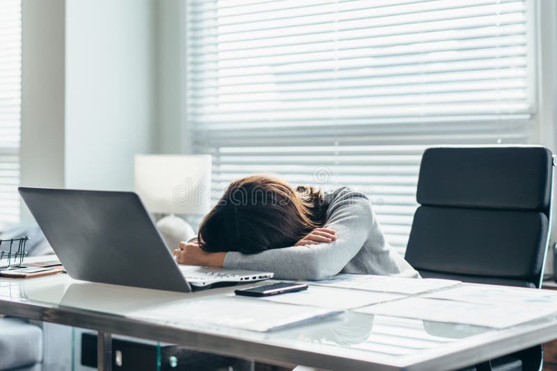 Young Woman in Office at Her Workplace is Tired and Resting Stock Photo ...