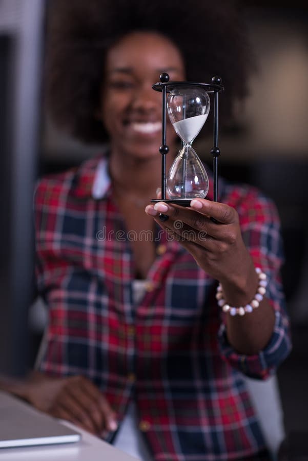 Young Woman at Office Looking at Sand Clock Stock Photo - Image of ...
