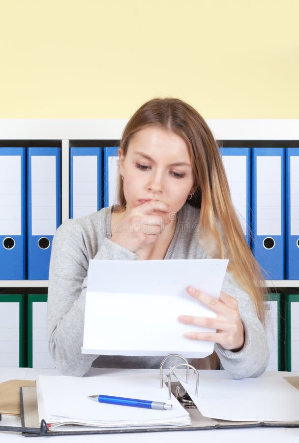 Young Woman at Office Reading a Letter Stock Image - Image of caucasian ...