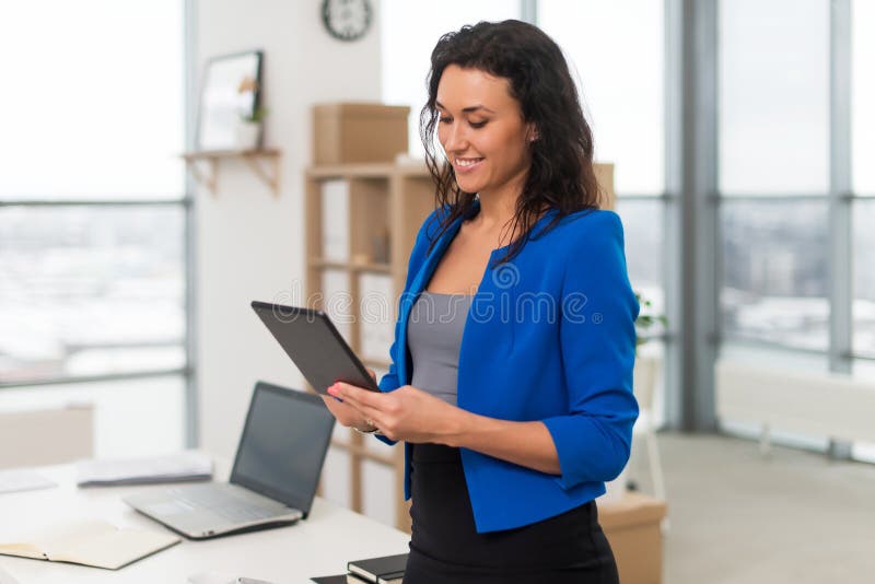 Young Woman in Office Using Tablet Computer Stock Image - Image of ...