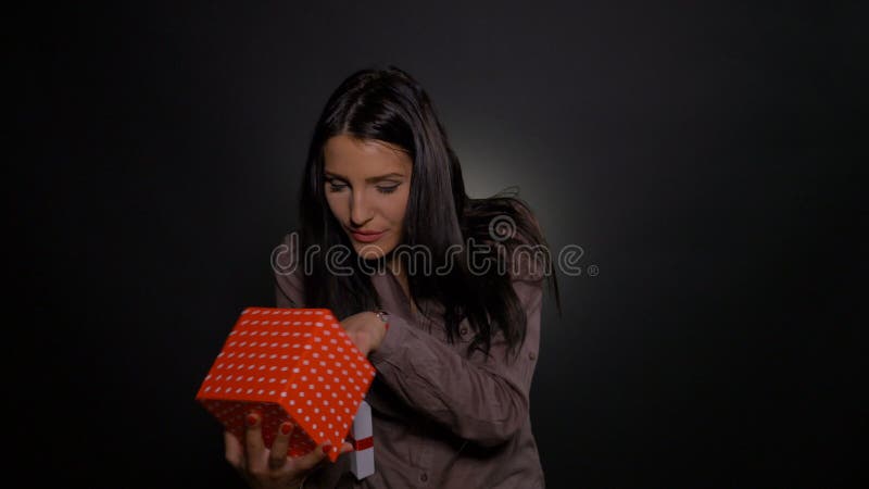 Young Woman Opening Gift Box and Getting Surprised by the Present Stock ...
