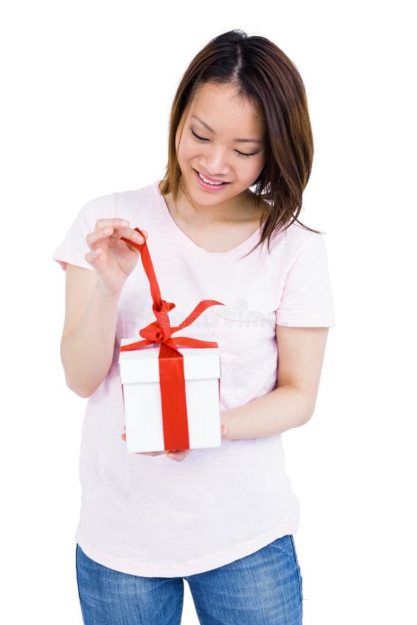 Woman Opening a Gift Sitting on the Floor Stock Image - Image of ...