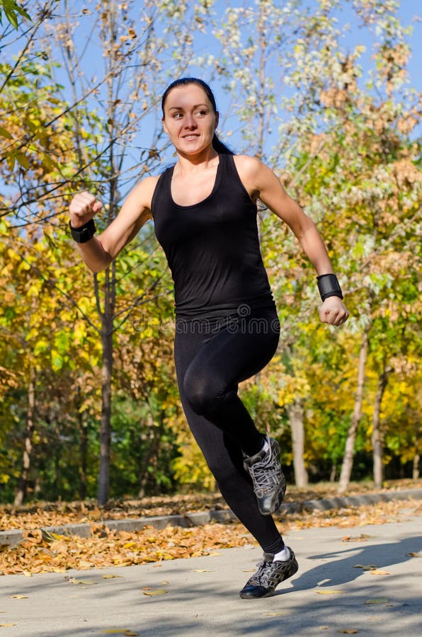 Young woman out jogging stock image. Image of brunette - 29434931