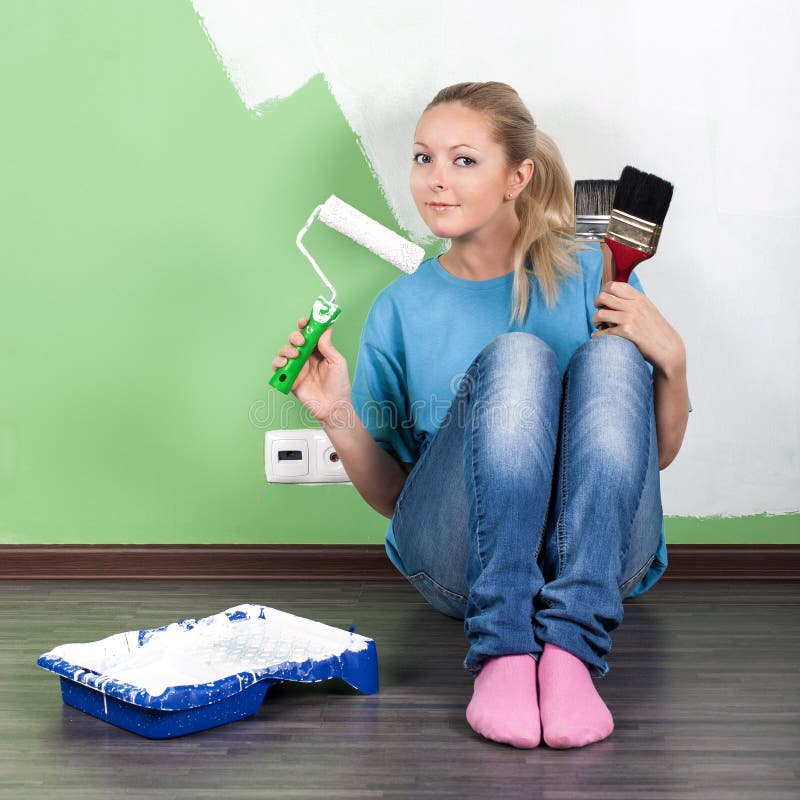 Joyful Young Woman Holding a Paint Brush Smiling Stock Image - Image of ...