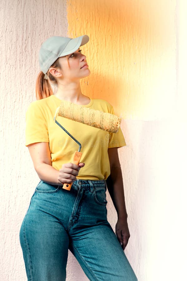 Painting a Wall with Paint Roller Stock Image - Image of yellow, paint ...
