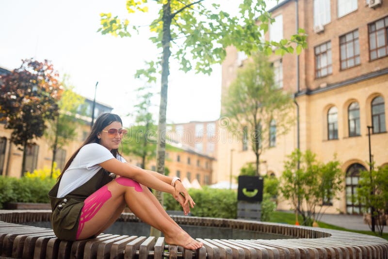 Young Woman on a Park Bench Posing at the Camera Stock Image - Image of ...