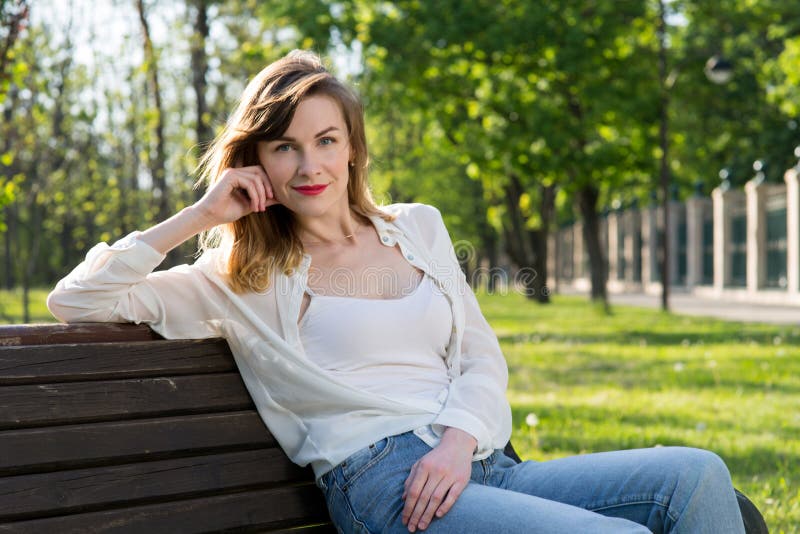 Young woman in the park stock image. Image of floral - 92113335