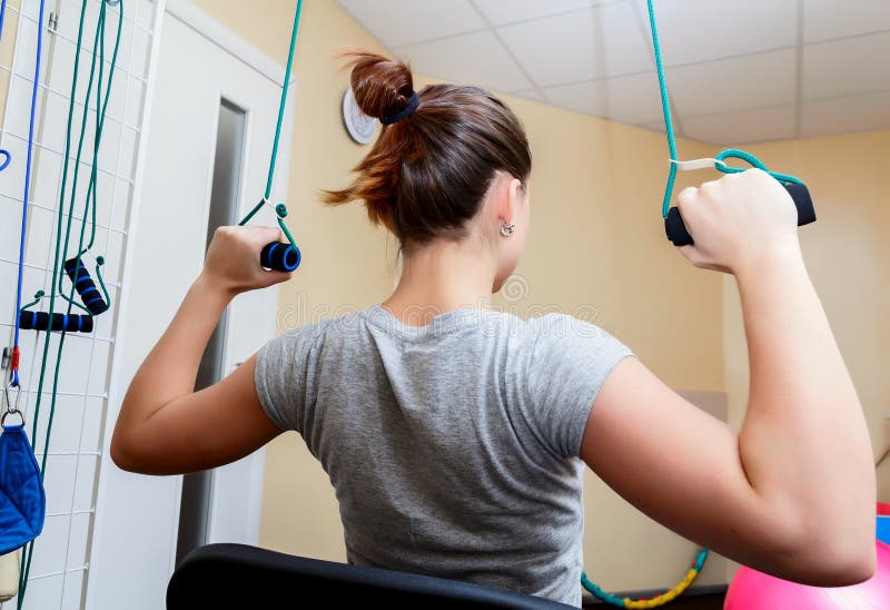 Young Woman Patient Doing Physical Exercises in a Rehabilitation Study ...
