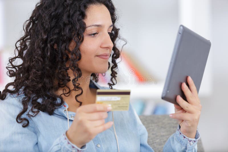 Young Woman Paying with Credit Card on Tablet Stock Image - Image of ...