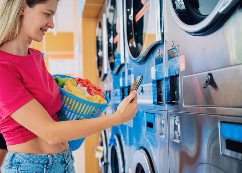 Young Woman Pays for Laundry Service Using Phone and Banking ...