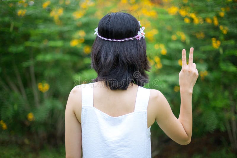 Young Woman with Peace Signs Stock Image - Image of beauty, cute: 96096939