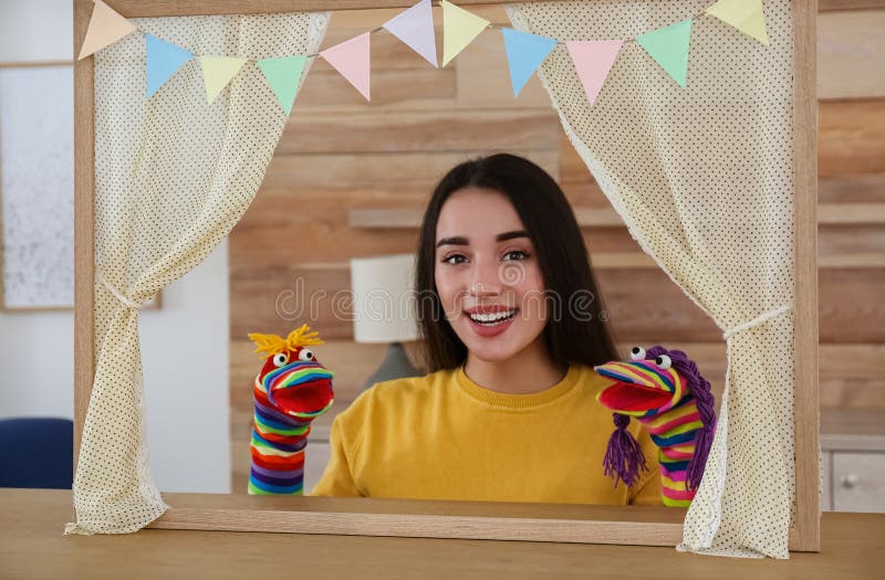 Young Woman Performing Puppet Show at Home Stock Photo - Image of ...
