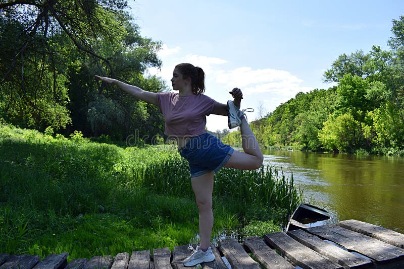 A Young Woman Performs an Exercise Stock Image - Image of activity ...