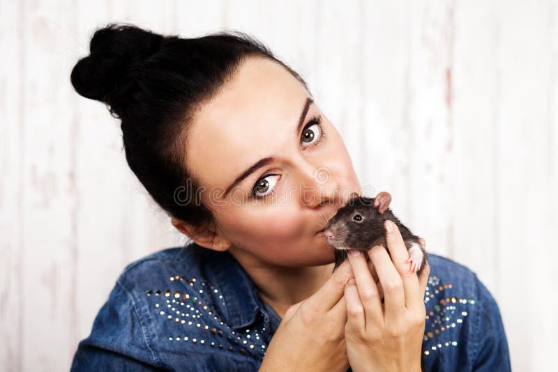 Young woman with a pet rat stock photo. Image of animal - 63784126