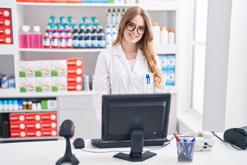 Young Woman Pharmacist Smiling Confident Using Computer at Pharmacy ...