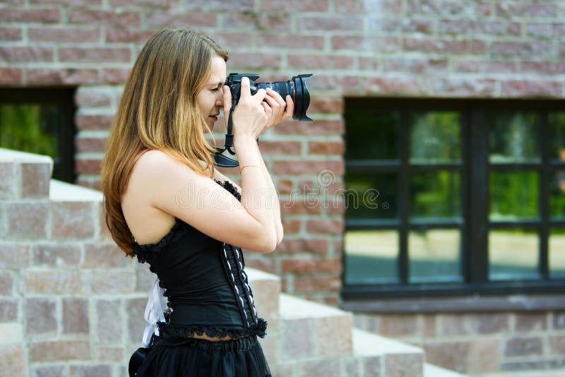 Woman holding camera stock image. Image of blonde, spring - 92417
