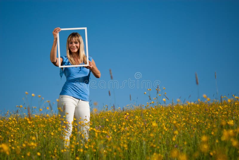 Young Woman with Picture Frame in the Countryside in Spring Stock Photo ...