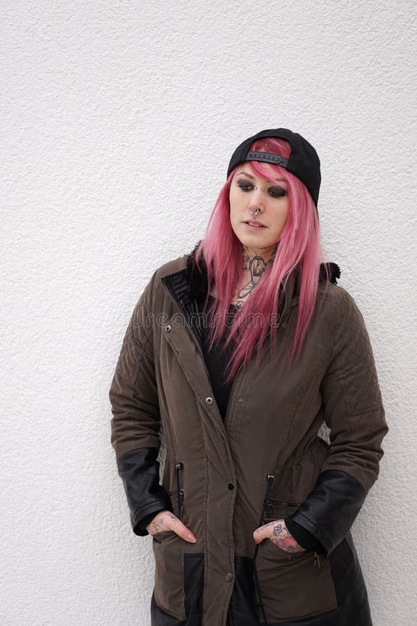 Young Woman with Pink Hair Looking Down Stock Image - Image of ...