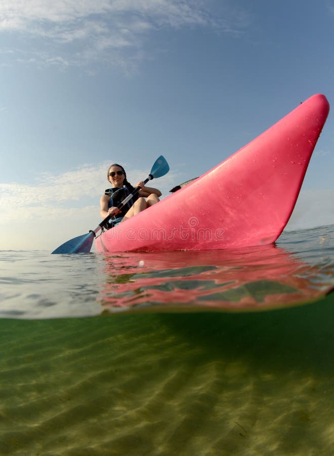Young woman in pink kayak stock image. Image of sunny - 72169675