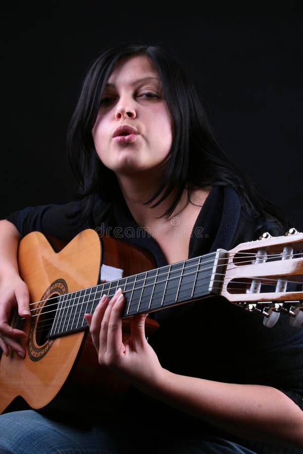 Young Woman Playing an Acoustic Guitar Stock Photo - Image of lady ...