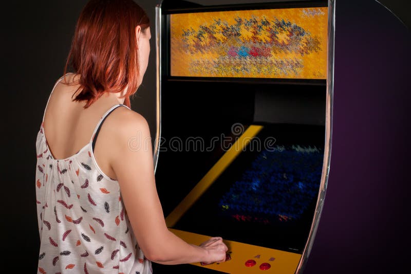 Young woman playing arcade stock image. Image of arcade - 78438981