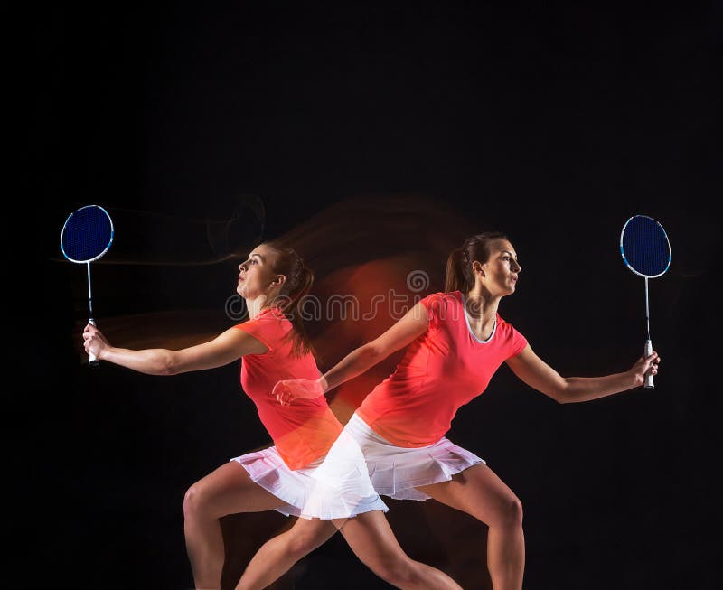 Young Woman Playing Badminton Over Black Background Stock Photo - Image ...