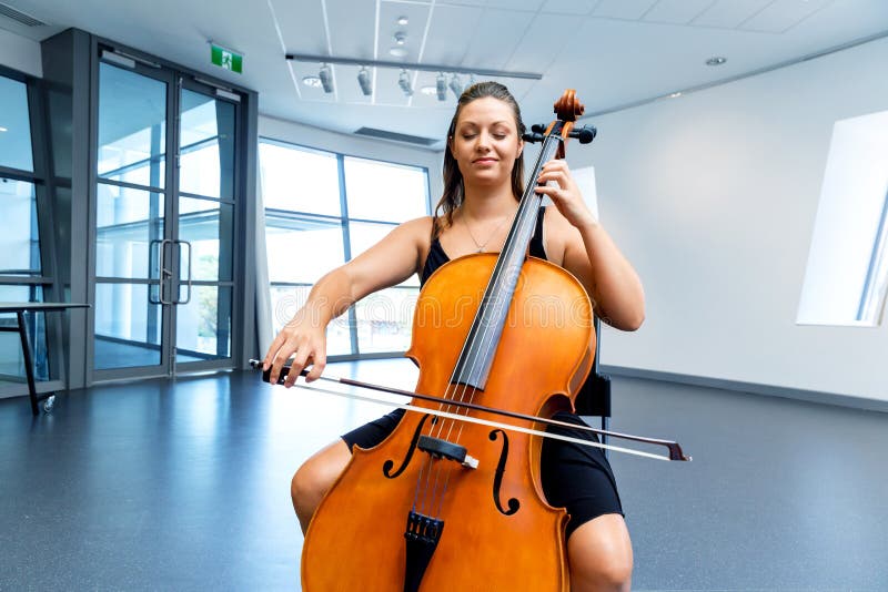 Woman playing cello stock photo. Image of beauty, play - 133318812