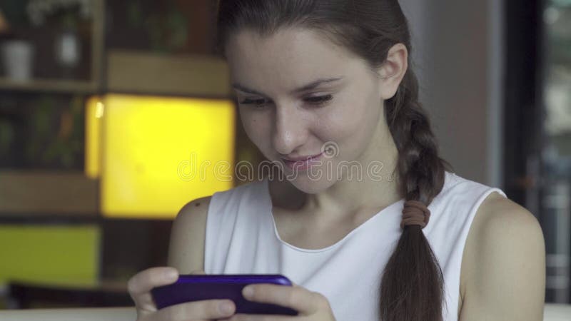 Young Woman Playing Game on Smartphone Stock Photo - Image of online ...