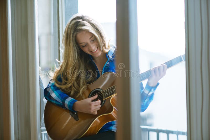 Young Female Playing Guitar in Western Style Stock Image - Image of ...