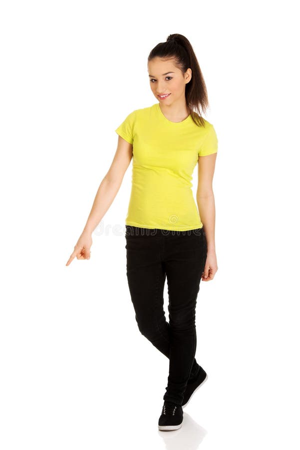 Young woman pointing down. stock photo. Image of isolated - 52725094