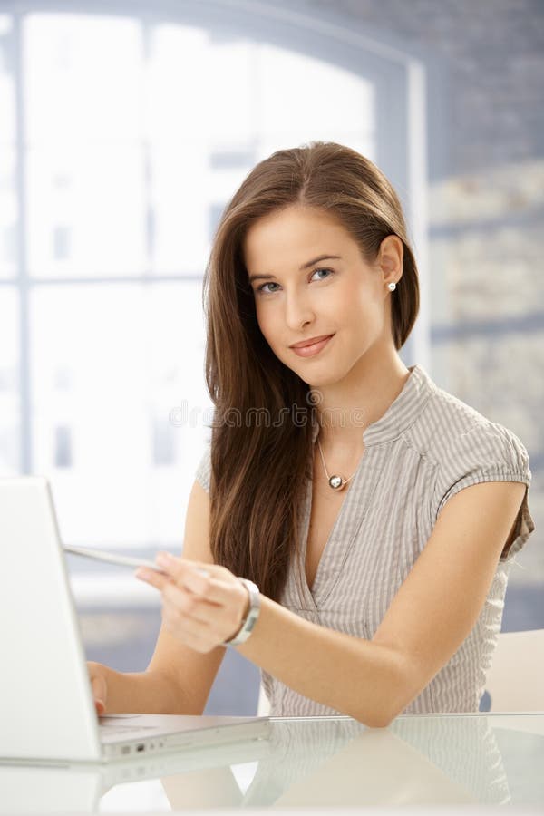 Young Woman Pointing at Laptop Screen Stock Image - Image of desk ...