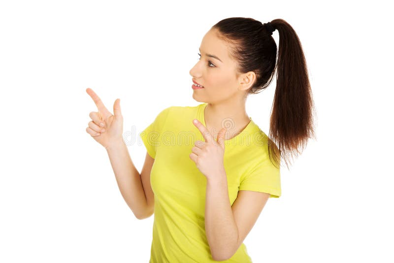 Young woman pointing up. stock photo. Image of brunette - 53681134