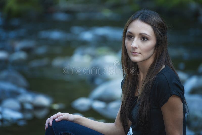 Young Woman Poses Along the Banks of a River Stock Image - Image of ...