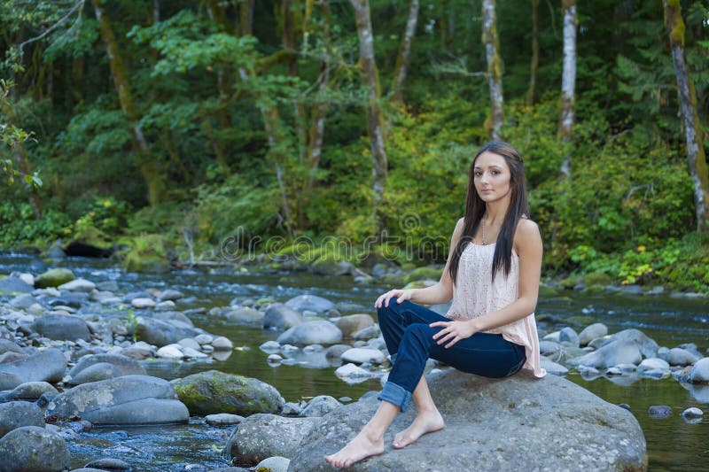 Young Woman Poses Along the Banks of a River Stock Photo - Image of ...
